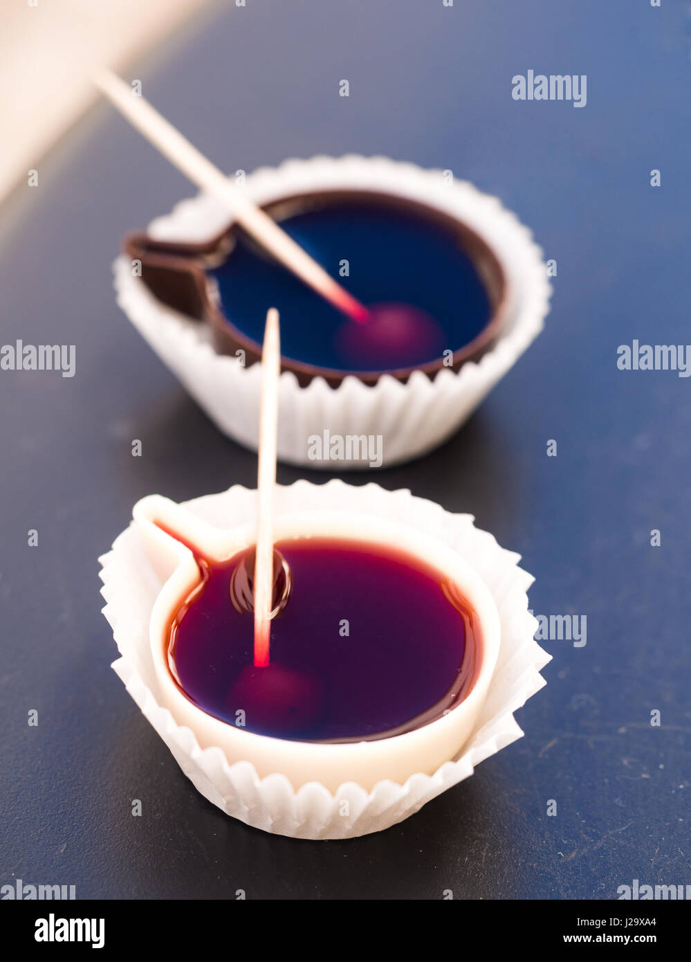 Ginja de Obidos, traditional sour cherry liquor, served in small cups ...