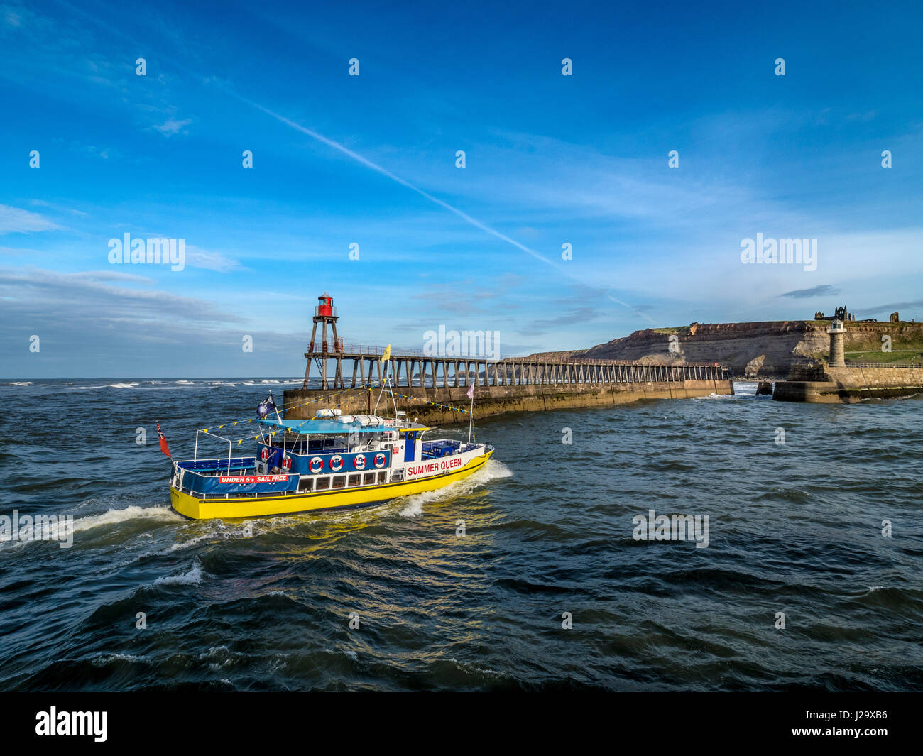 Yellow Summer Queen tourist boat entering harbour, Whitby, UK Stock ...