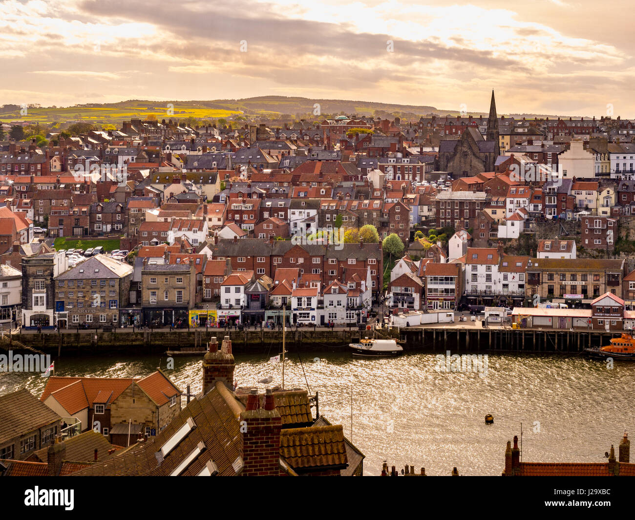 Whitby harbourside buildings and town seen from St Mary's Church steps ...