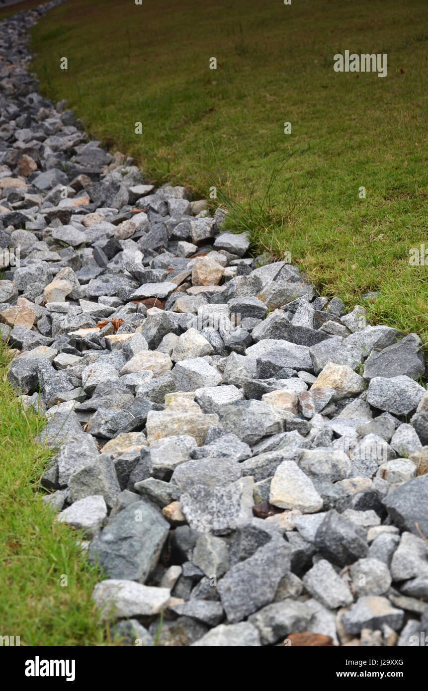 Stone and green grass in the garden Stock Photo - Alamy