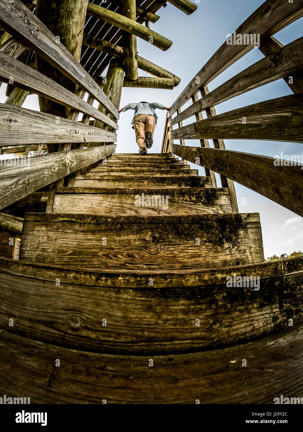 Woman Climbing Wooden Stairs Stock Photo - Alamy