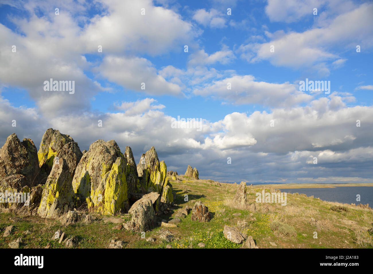 A rocky outcrop along the shore of Sierra Brava reservoir in ...