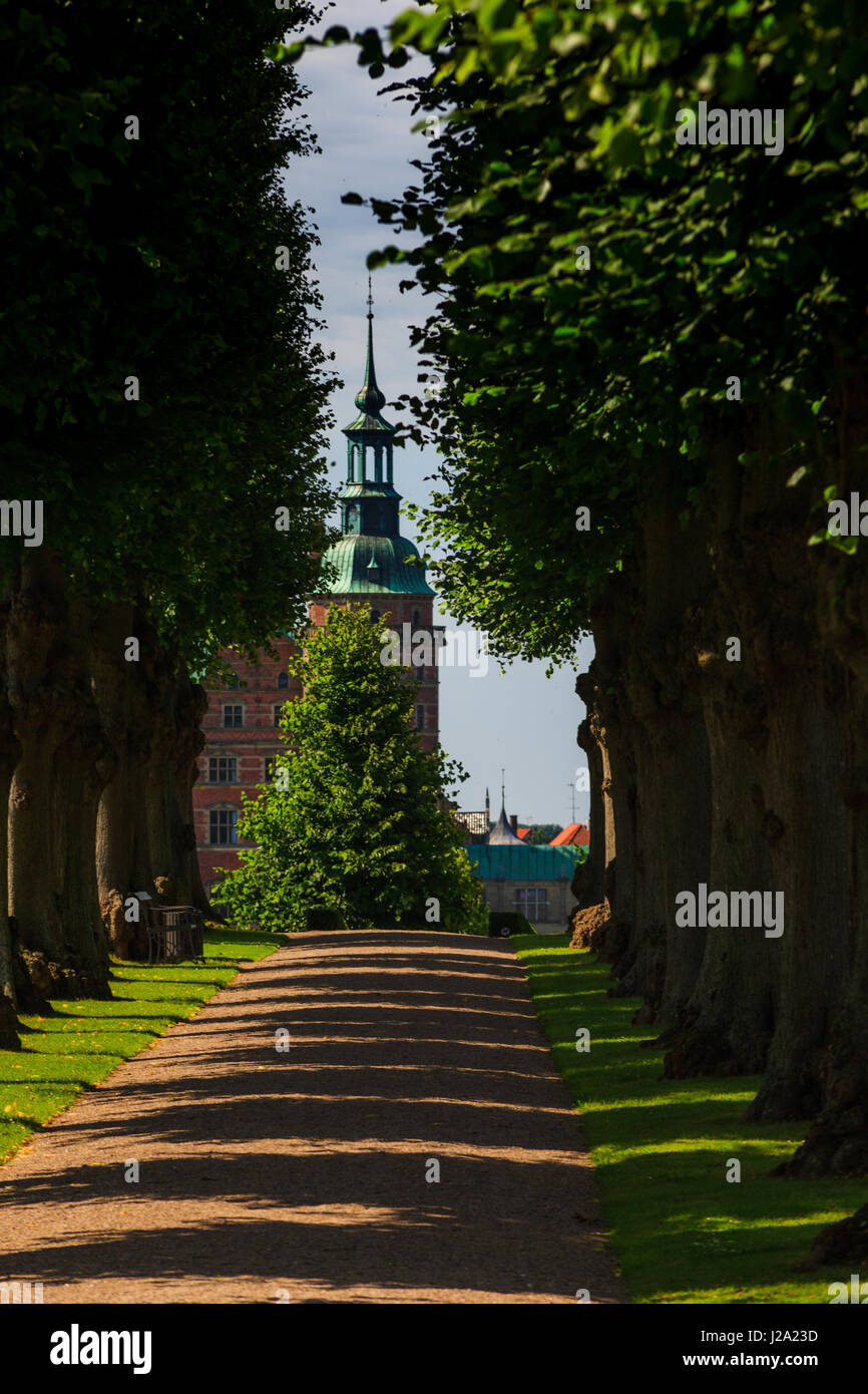 A beautiful summer green ale leading to Frederiksborg Palace in Denmark ...