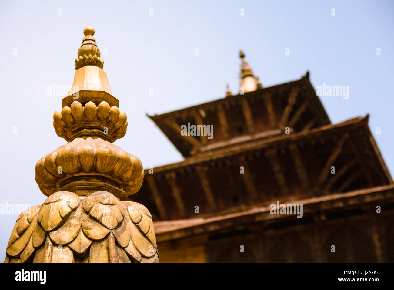 Close up detail of the top of a stupa decorated with gold and one of ...
