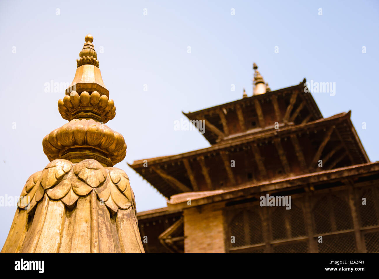Close up detail of the top of a stupa decorated with gold and one of ...