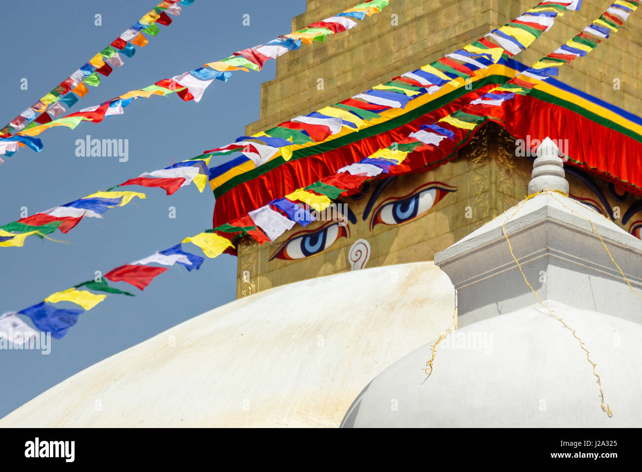 Closeup of the Buddha eyes of Boudhanath stupa surrounded by prayer ...