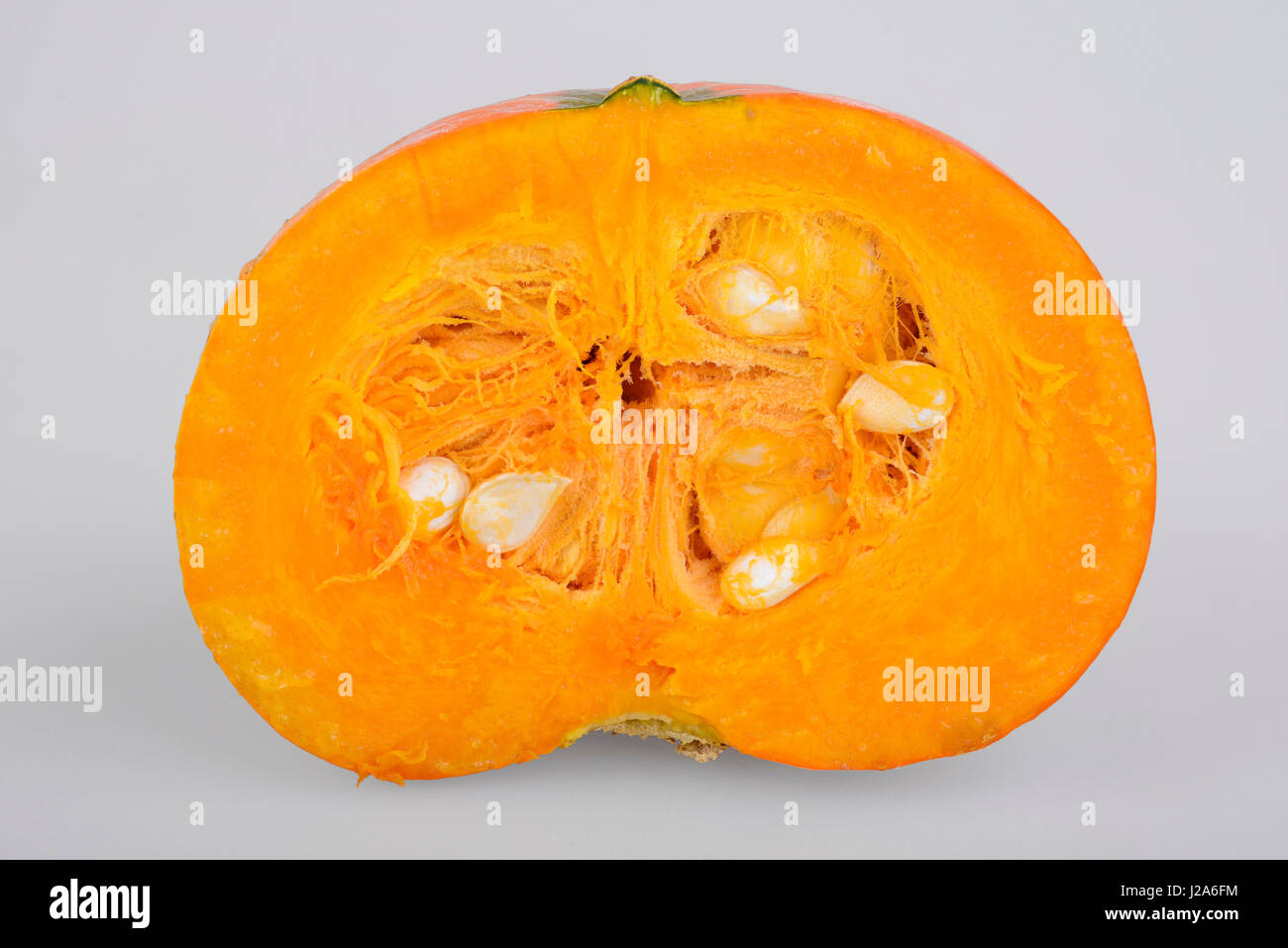 ripe yellow pumpkin half cut isolated on white background Stock Photo ...
