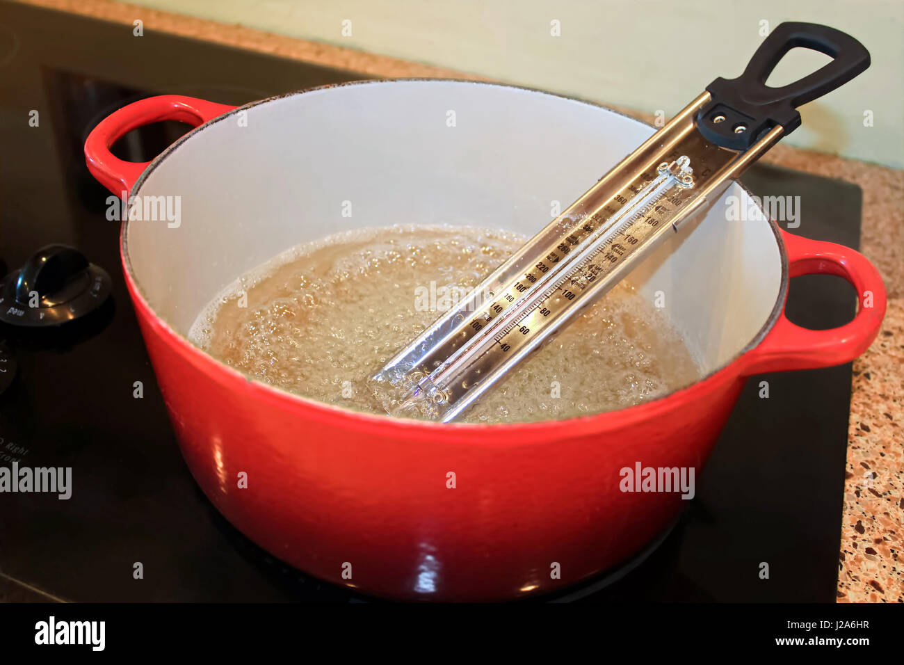 Candy Thermometer in Pot of Boiling Sugar Stock Photo - Alamy