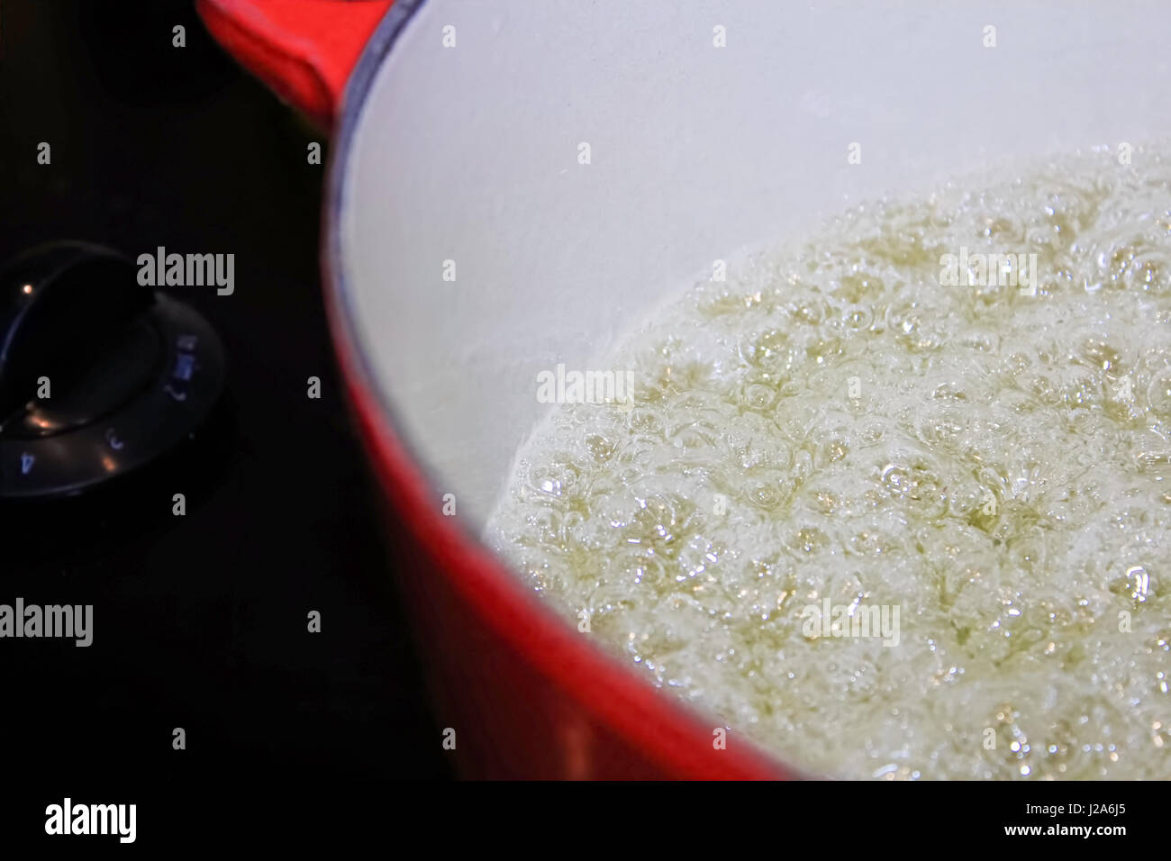 Water boiling in red pot hi-res stock photography and images - Alamy