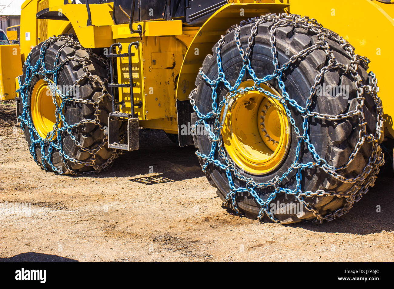 Chains On Snow Tires On Bulldozer Stock Photo - Alamy