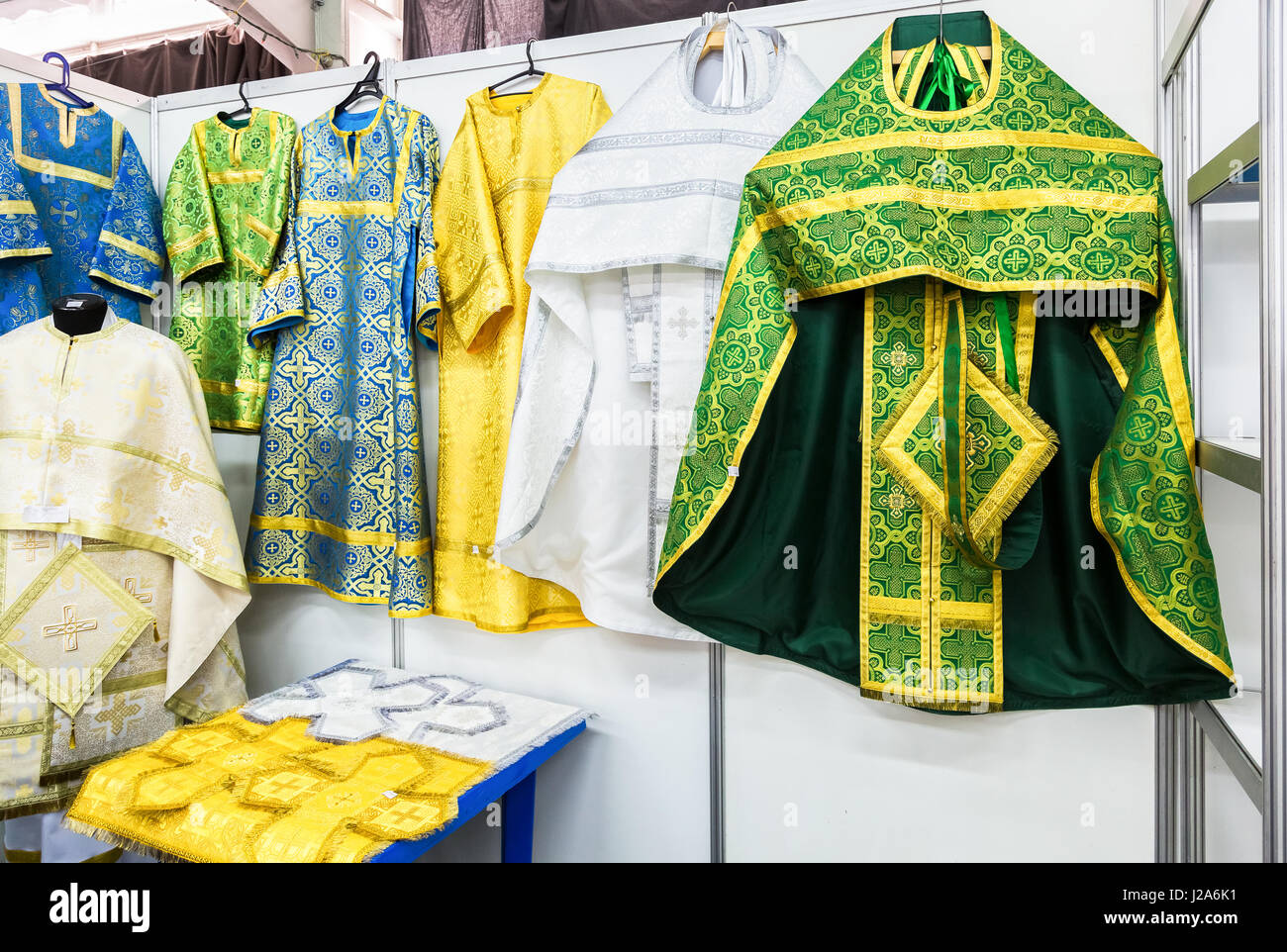Different solemn slavic orthodox priest's vestments Stock Photo - Alamy