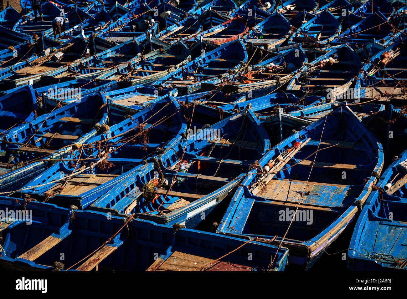 Traditional blue fishing boats in the harbour of Essaouira in Morocco ...