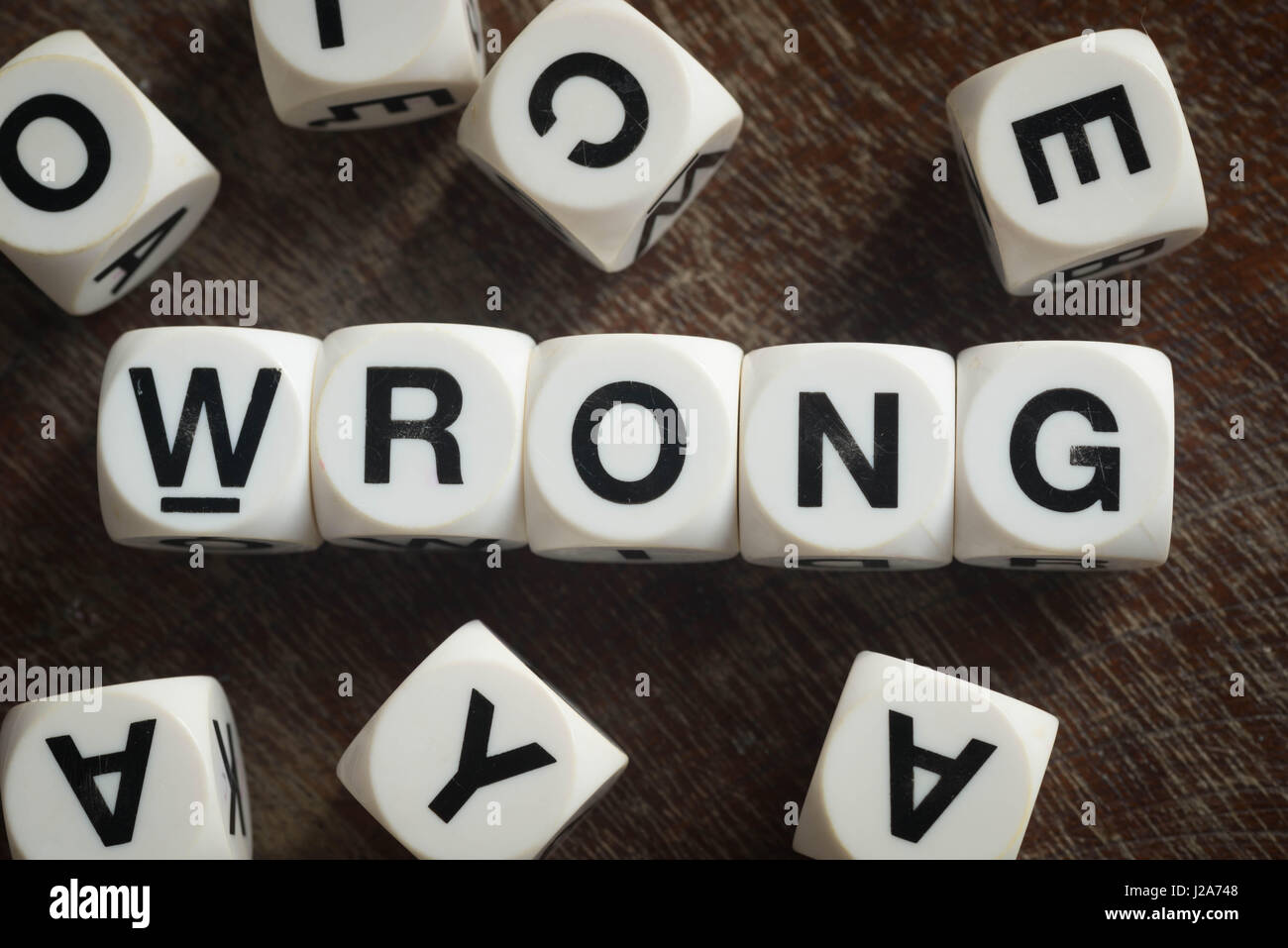 word wrong on white toy cubes Stock Photo - Alamy