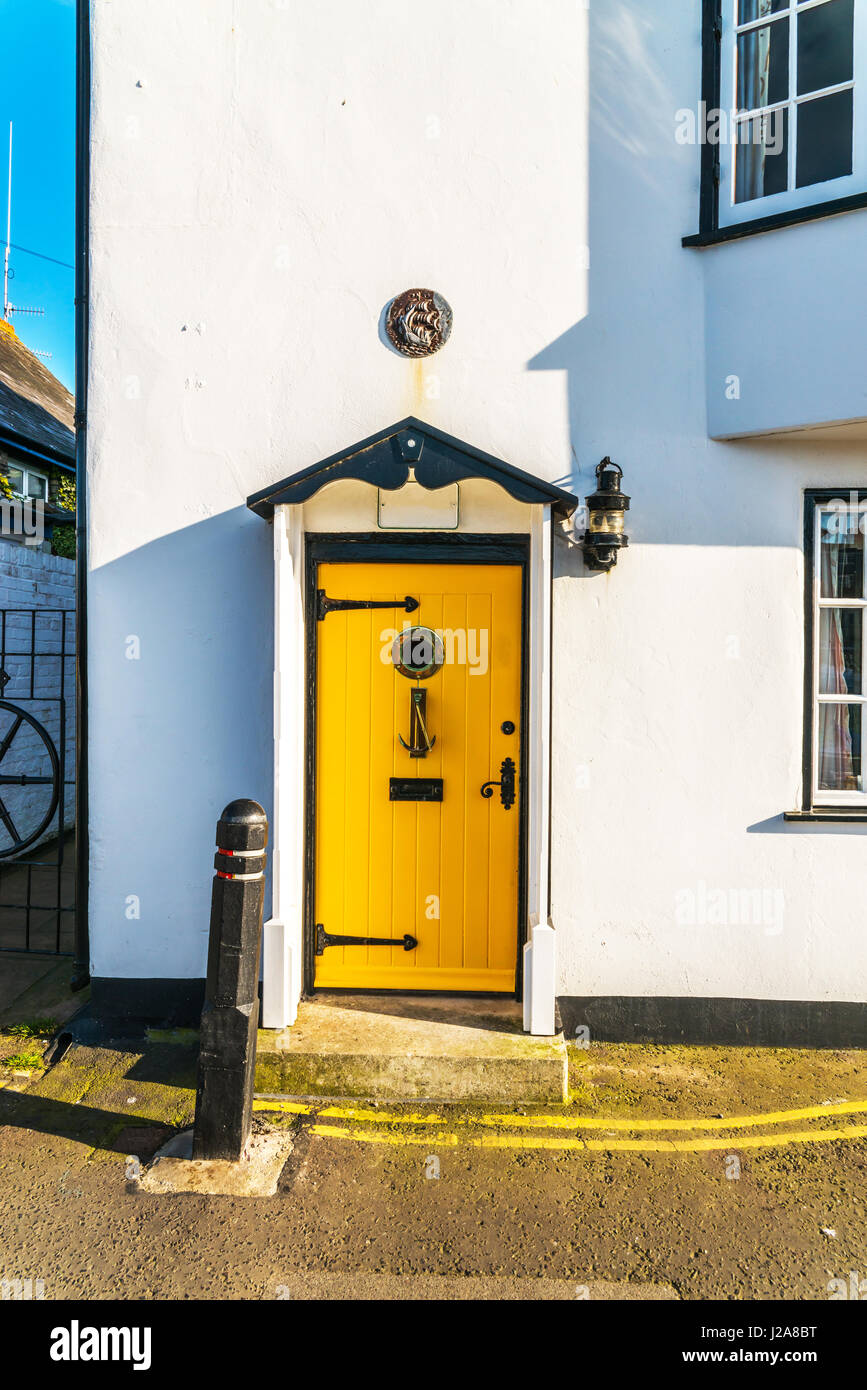Interesting entrance to the building, yellow door with bull's eye and ...