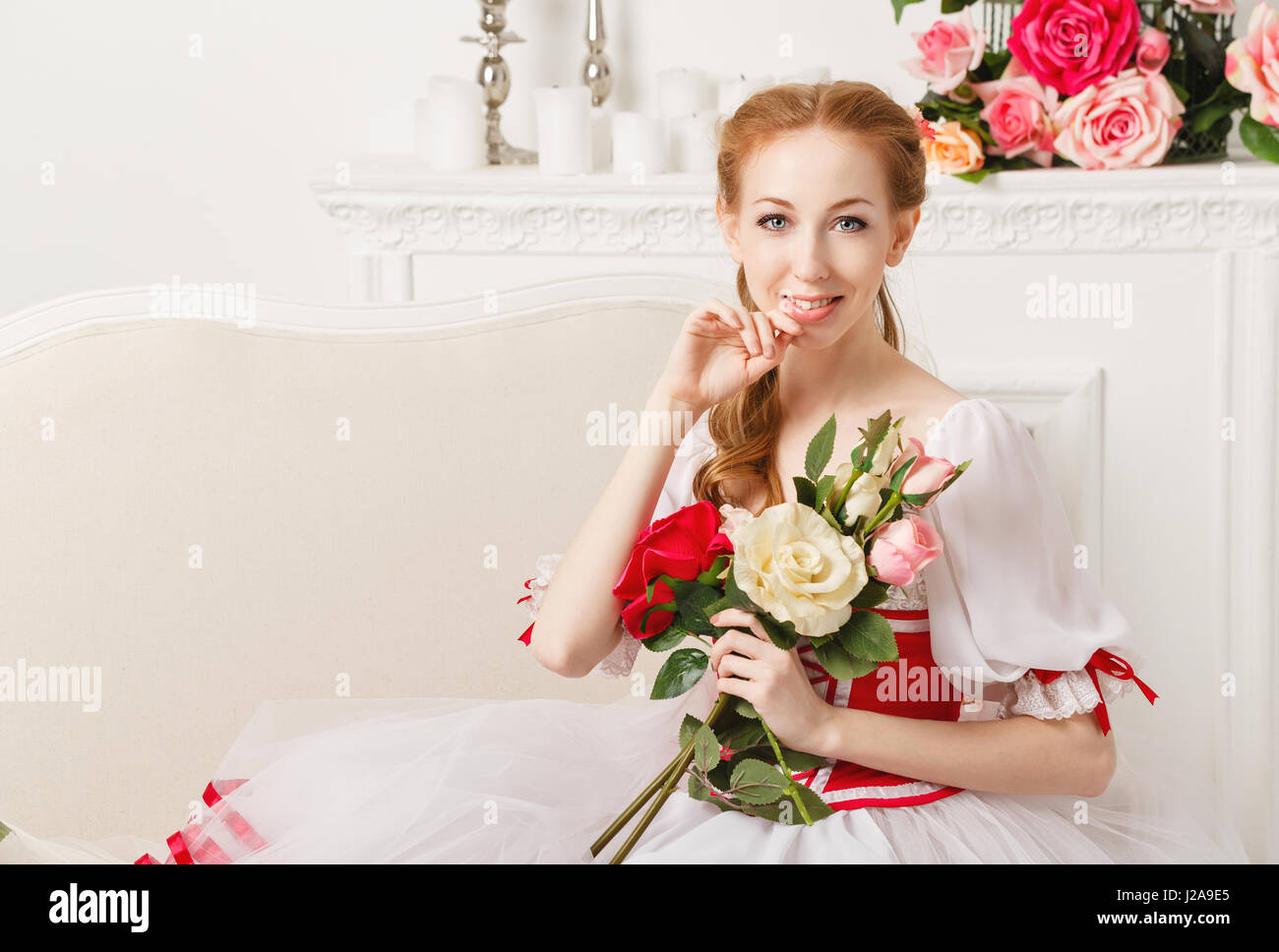 Sweet Ballerina In A Stage Costume Holds A Bouquet Of Spring Flowers