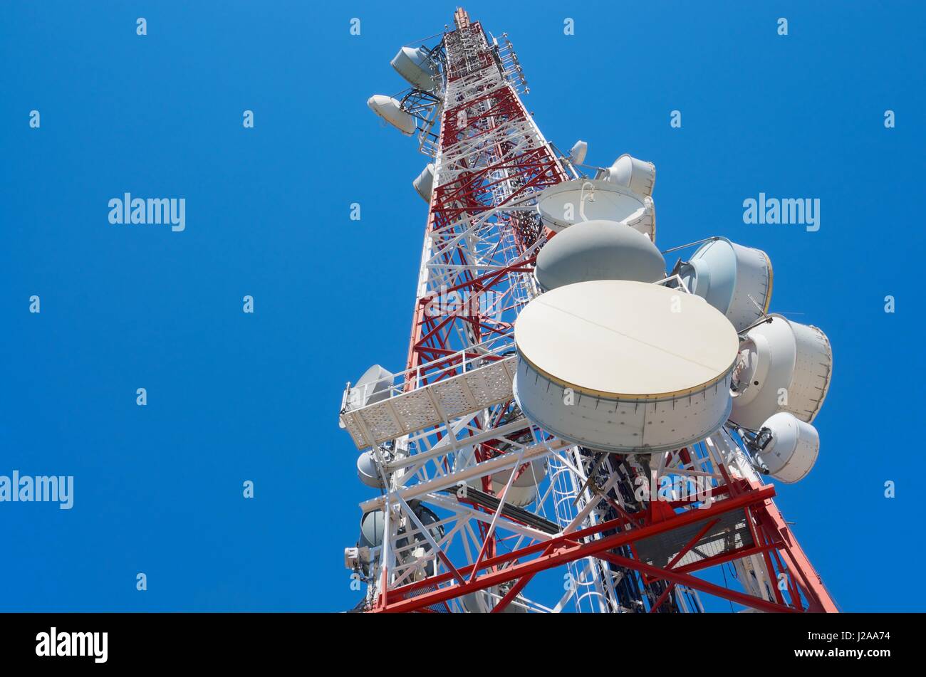 bottom view of a telecommunications tower with a clear blue sky Stock ...