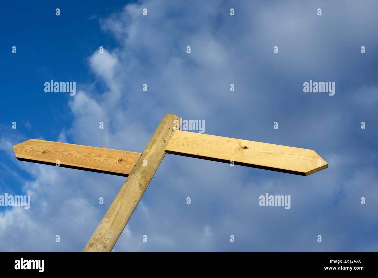 view of two wooden directional signs on a pole Stock Photo - Alamy