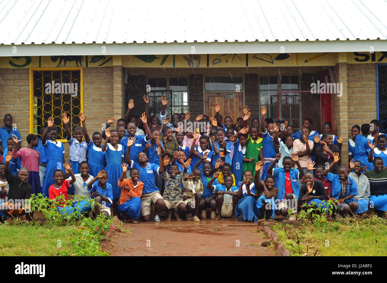 Malawi, Lilongwe, Chambwe Primary School, Pupils jump with happiness ...