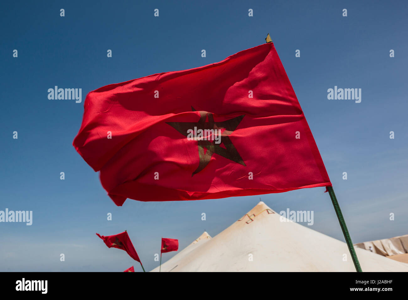 Africa, Western Sahara, Dakhla. The flag of Morocco blowing in the wind ...