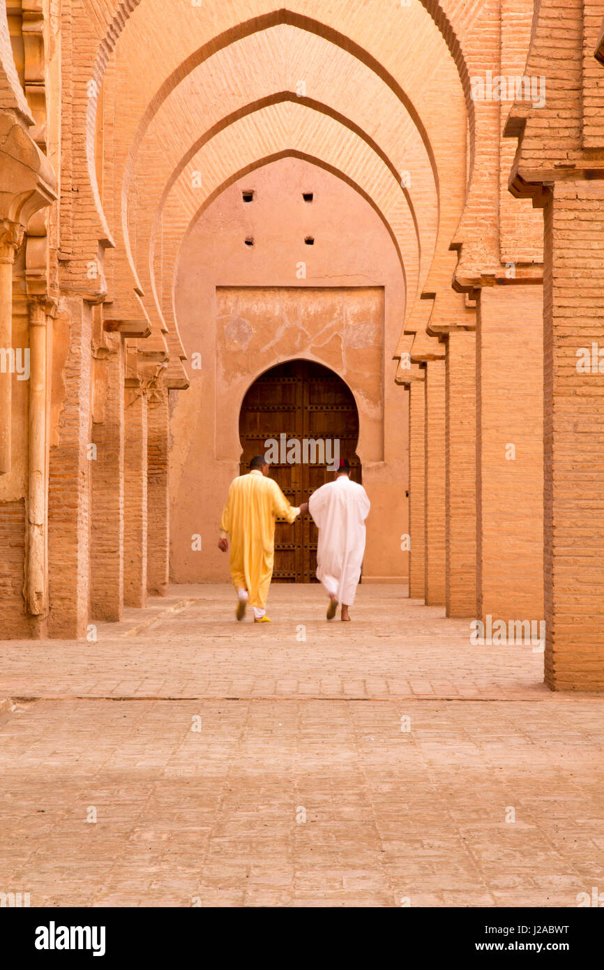 Morocco, Marrakech, Tinmal. Men walking toward mosque door. They are ...