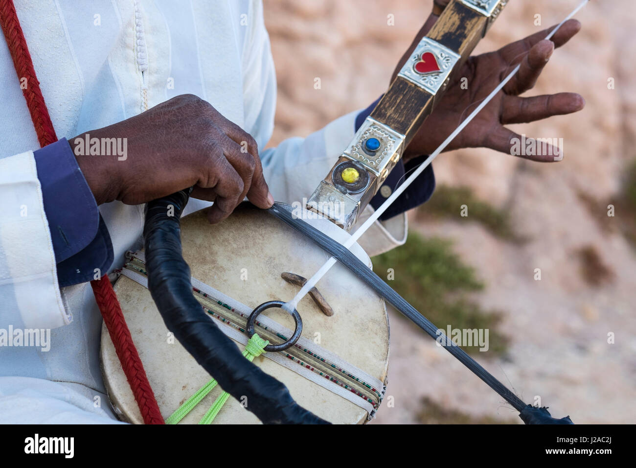 Morocco, Ouarzazate, Ait Benhaddou. Man playing Rubab, Moroccan single ...