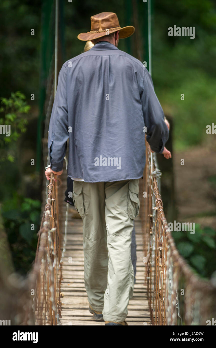 Africa, Tanzania, man crossing bridge Stock Photo - Alamy