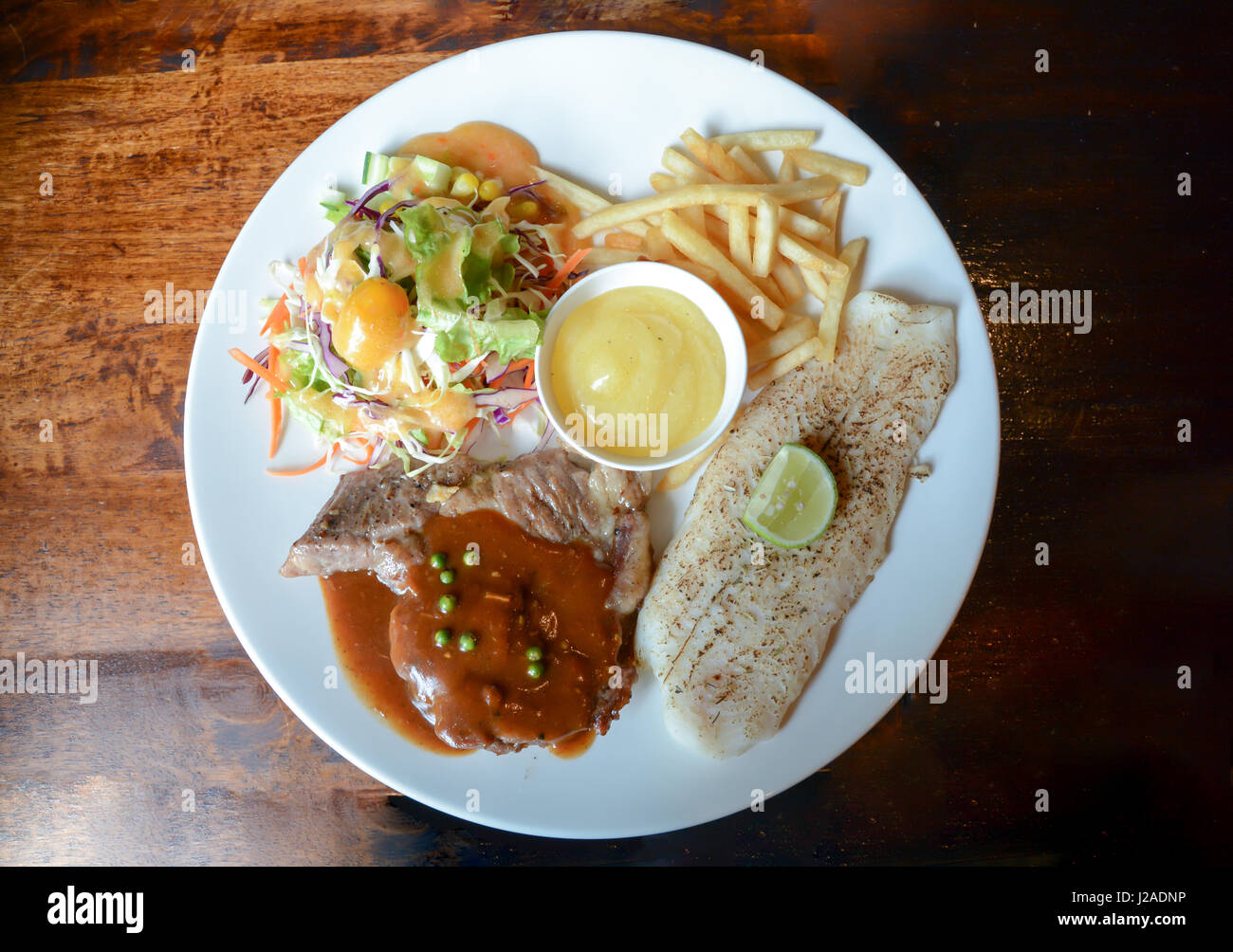 Grilled pork steak and grilled fish steak Stock Photo - Alamy