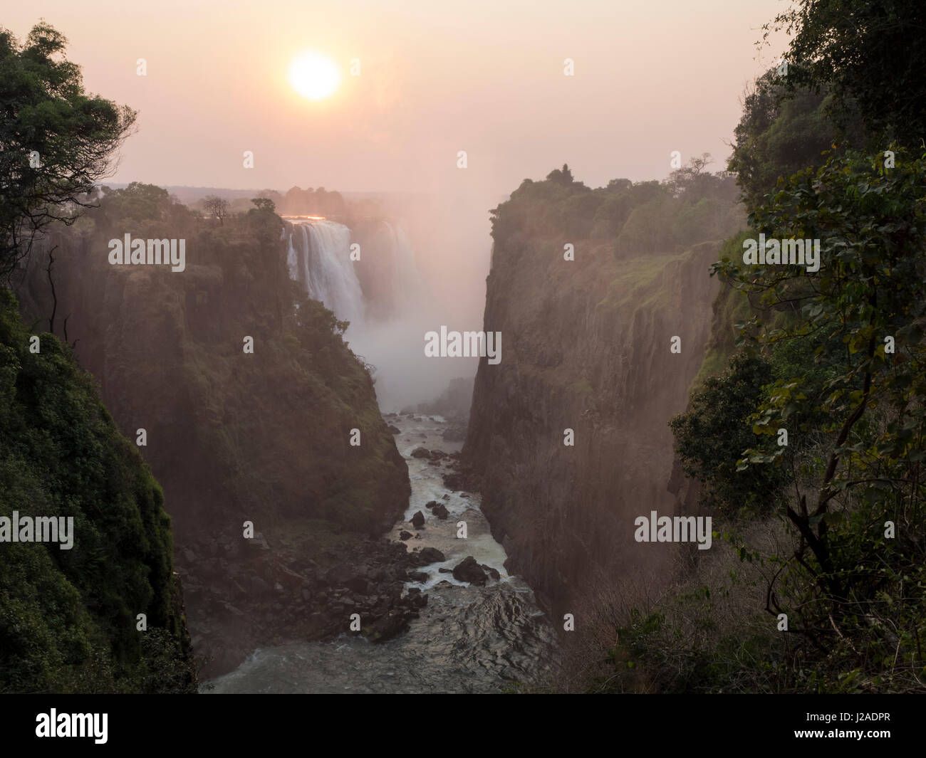 Africa, Zimbabwe, Victoria Falls. View of waterfalls at sunrise. Credit ...