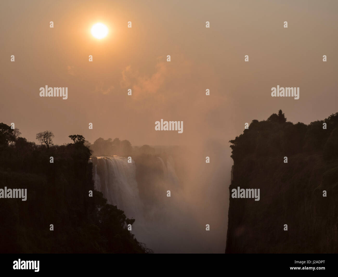 Africa, Zimbabwe, Victoria Falls. View of waterfall at sunrise. Credit ...