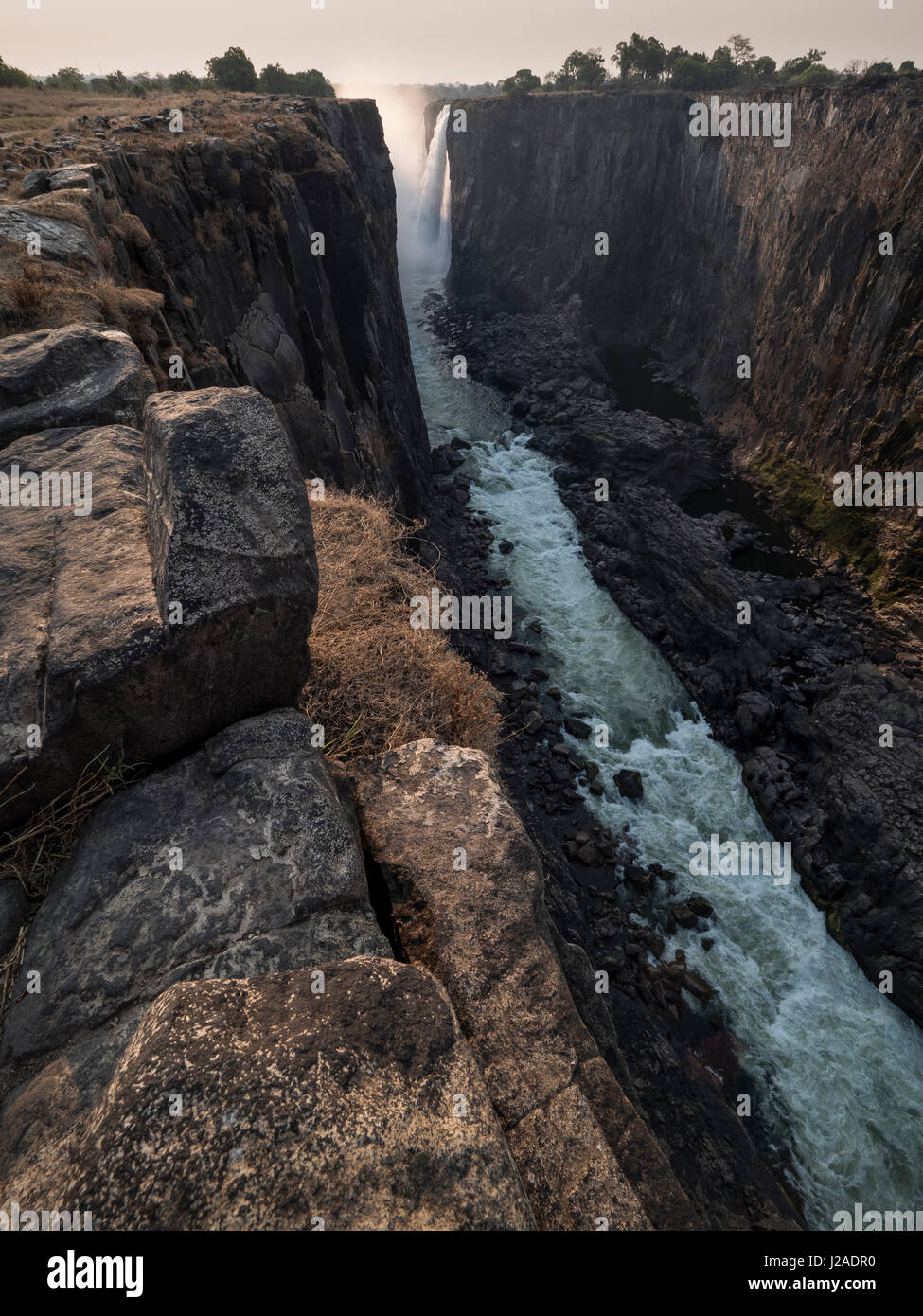 Africa, Zimbabwe, Victoria Falls. Waterfall and Zambezi River amid ...