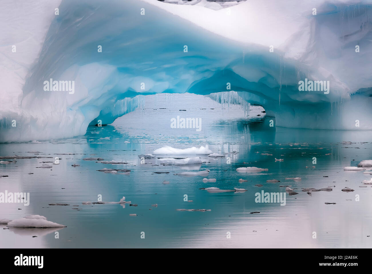 Antarctica. Artistic open arch in an iceberg Stock Photo - Alamy