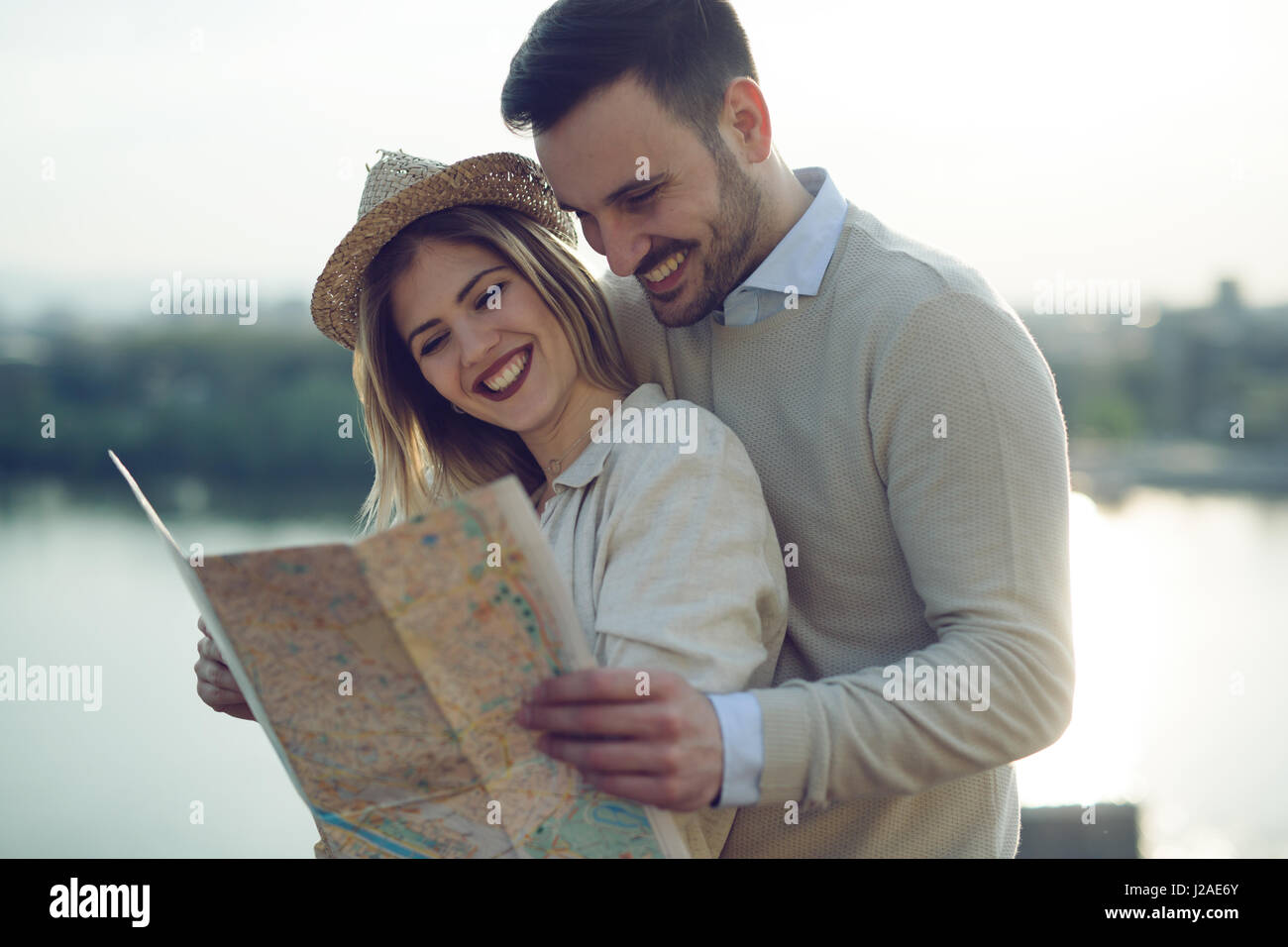 Happy tourists traveling and smiling while sightseeing Stock Photo - Alamy