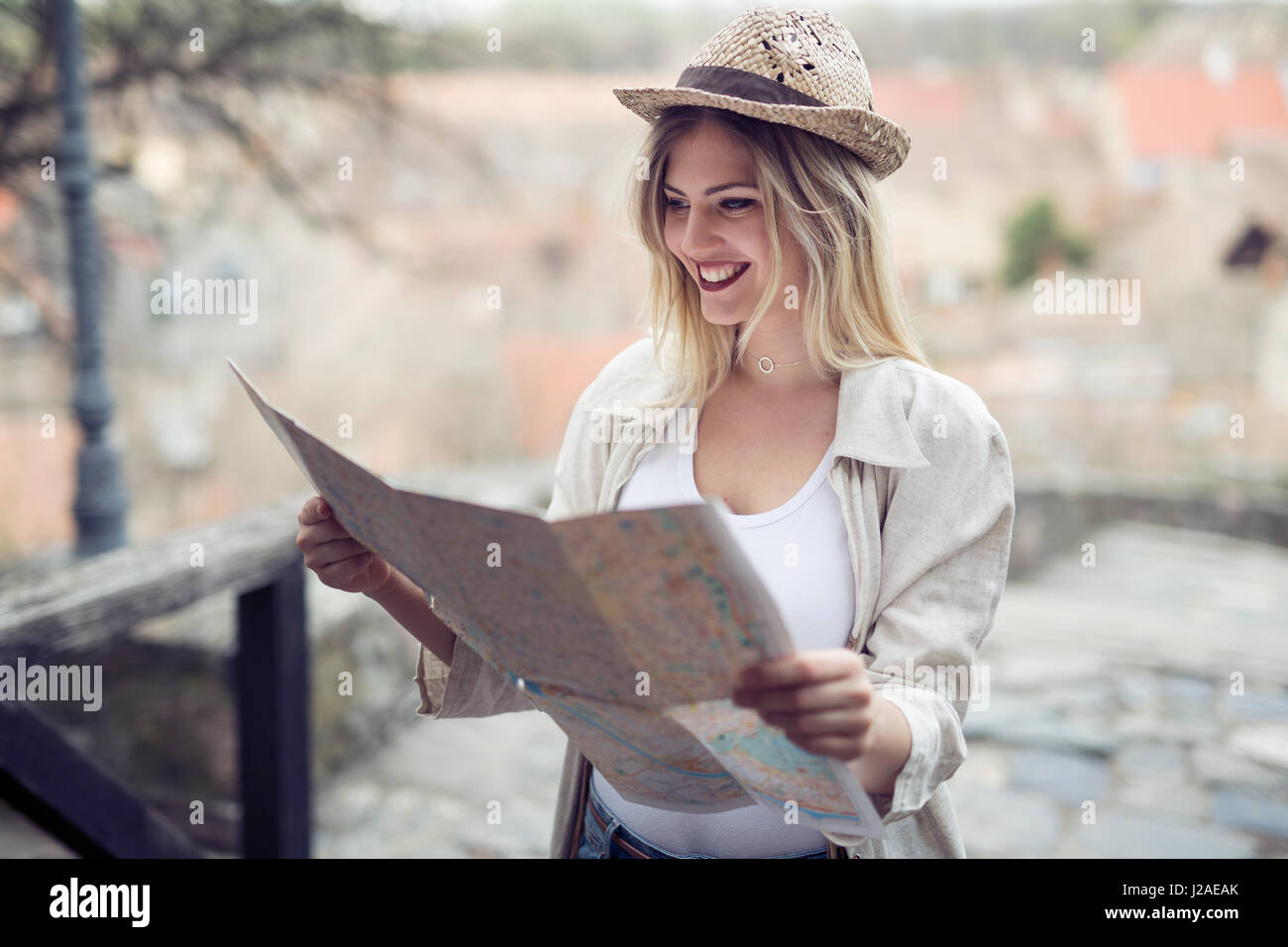 Happy beautiful female tourist sightseeing and exploring Stock Photo ...