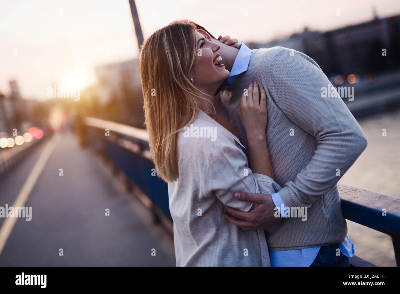 Couple sun laughing hugging hi-res stock photography and images - Alamy