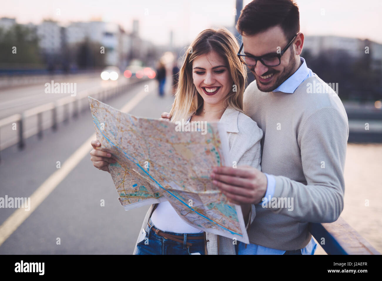 Happy tourists traveling and smiling while sightseeing Stock Photo - Alamy