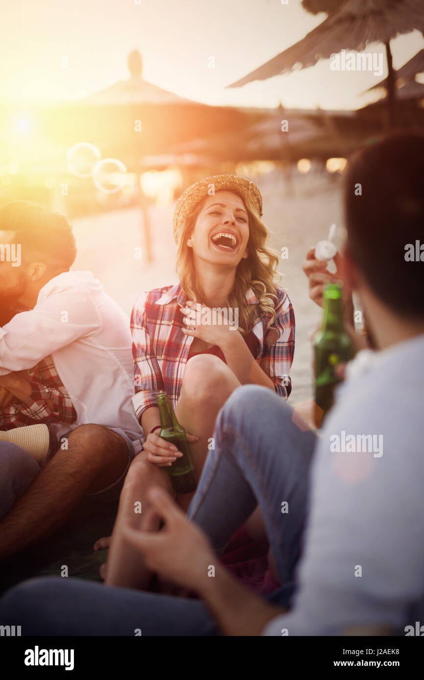 Happy friends partying and having fun on beach at summer Stock Photo ...
