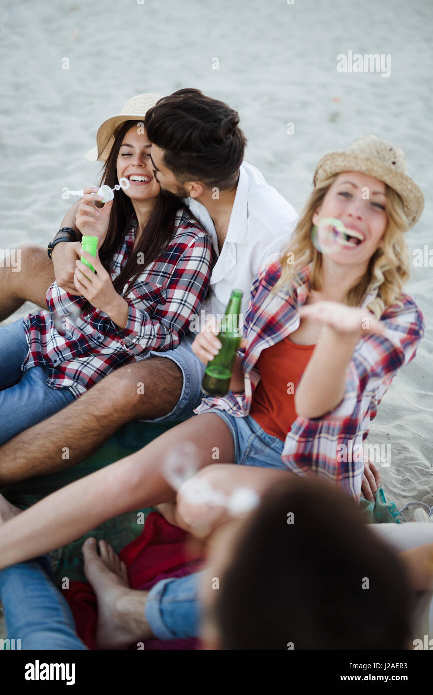 Happy group of young friends having fun on beach in summer Stock Photo ...