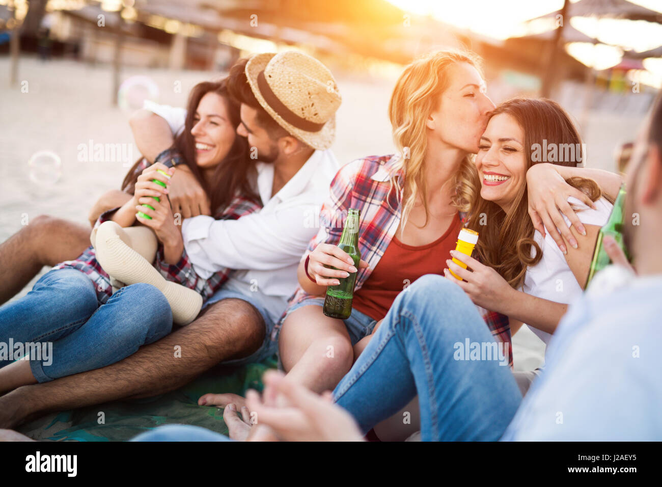 Happy group of young friends having fun on beach in summer Stock Photo ...