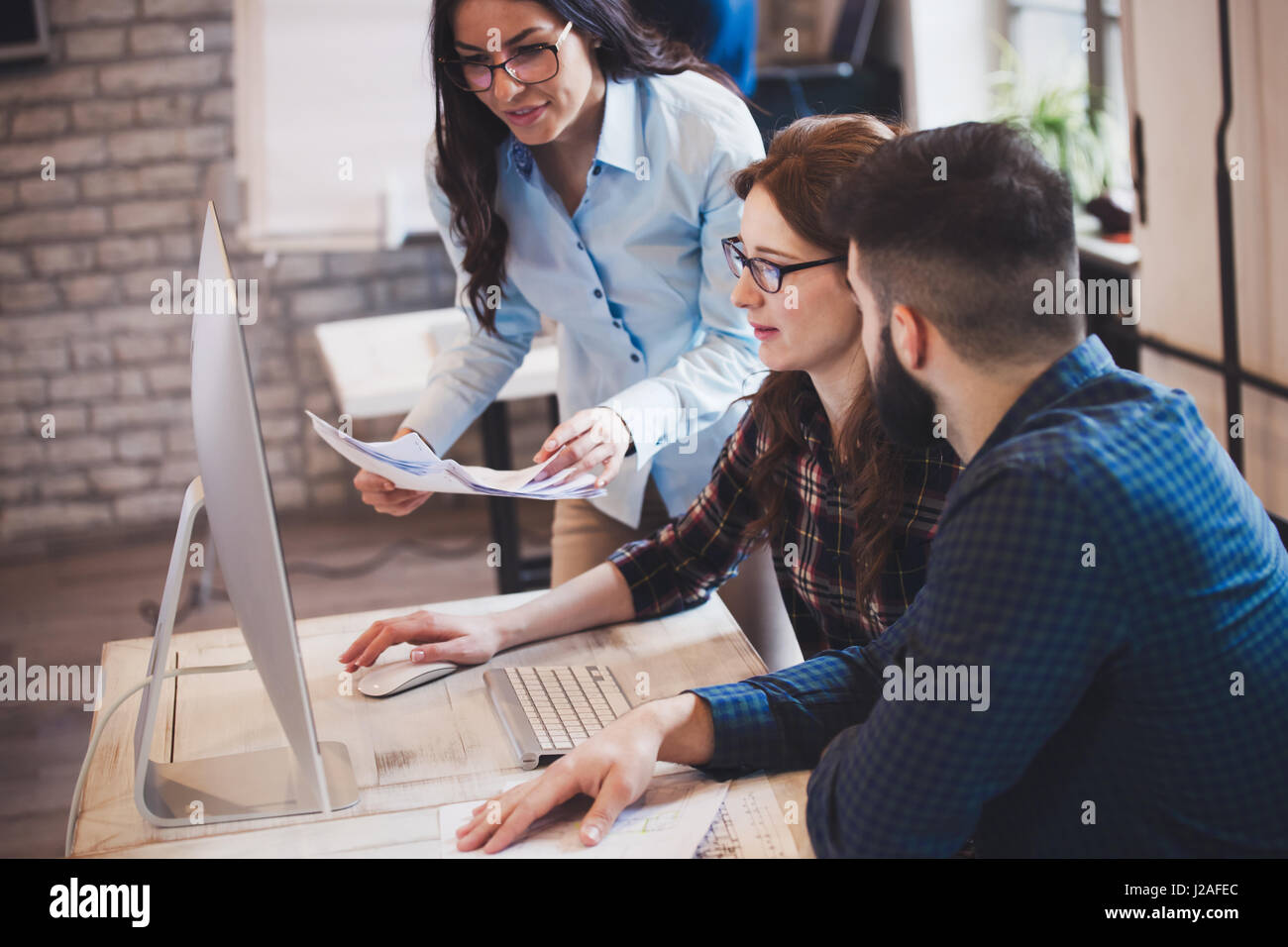 Company employees working in software development and designer office ...