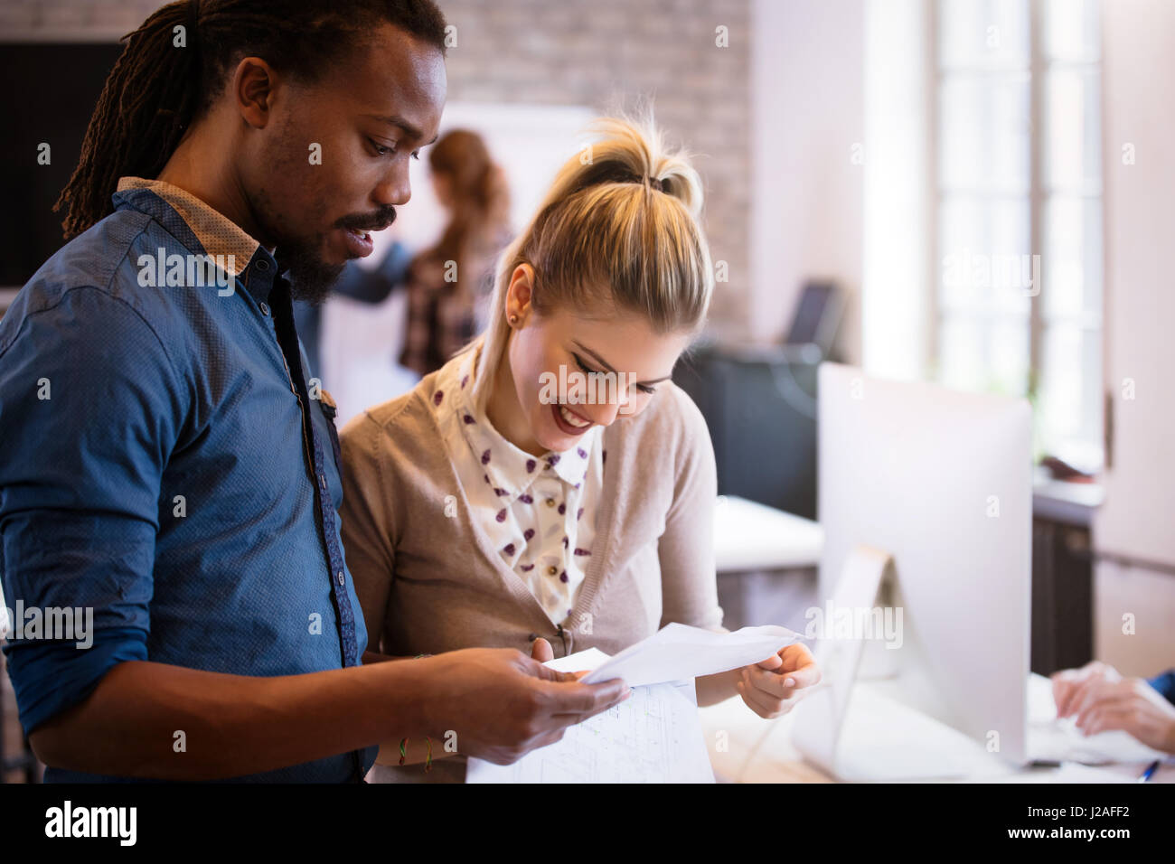 Company coworkers discussing ideas and brainstorming in office Stock ...