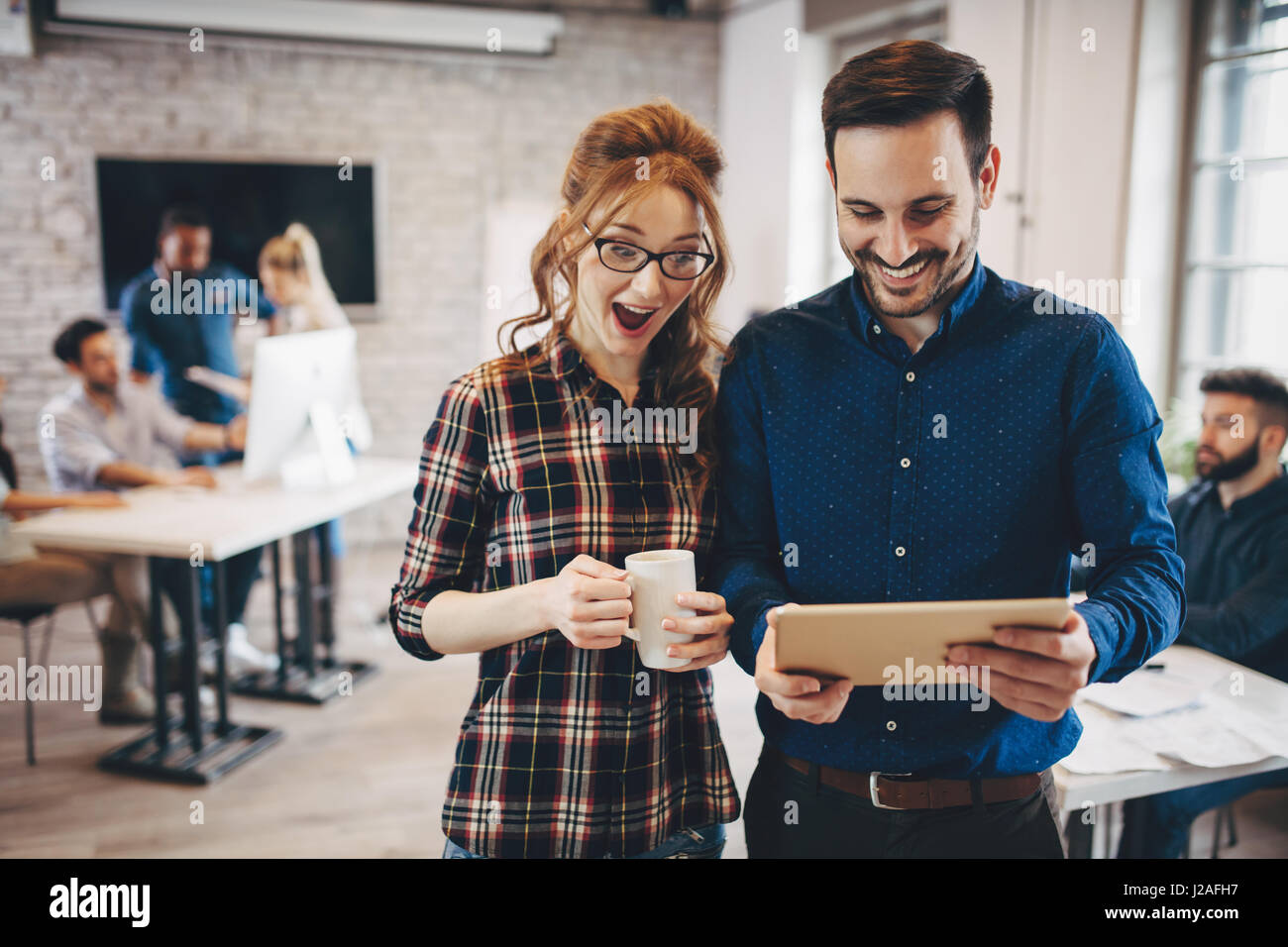 Successful happy coworkers communicating in modern company office Stock ...