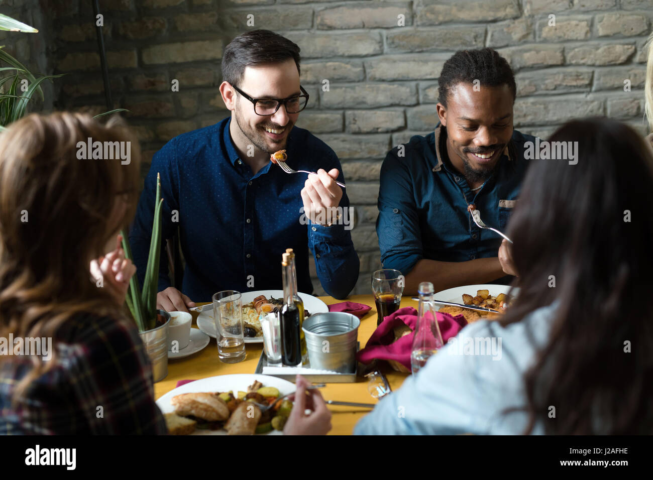Group of happy business people eating together in restaurant Stock ...