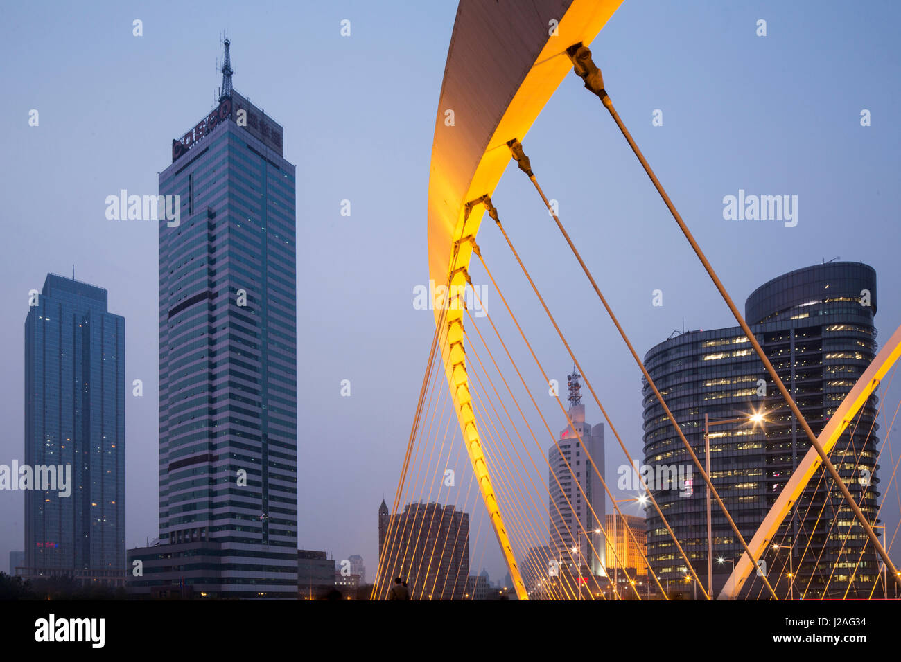 China, Tianjin, Steel arch of Dagu Bridge with steel and glass ...