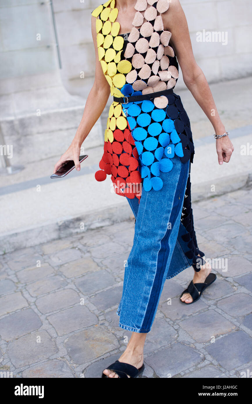 Fashionable woman in belted tabard of coloured circles, crop Stock ...