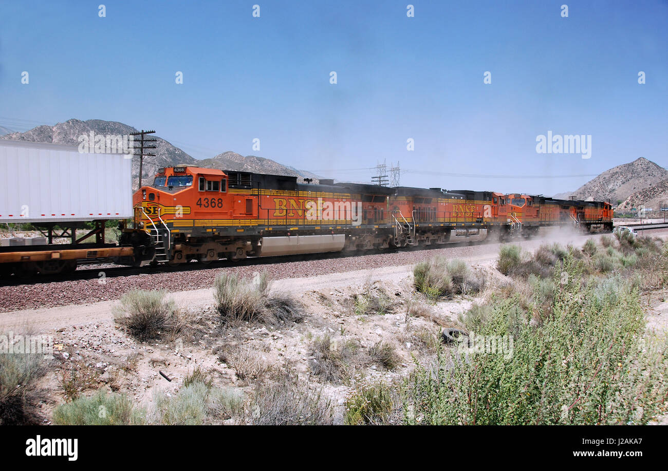 BNSF freight train and truck race at Cajon Pass, San Bernardino County, California, USA Stock ...