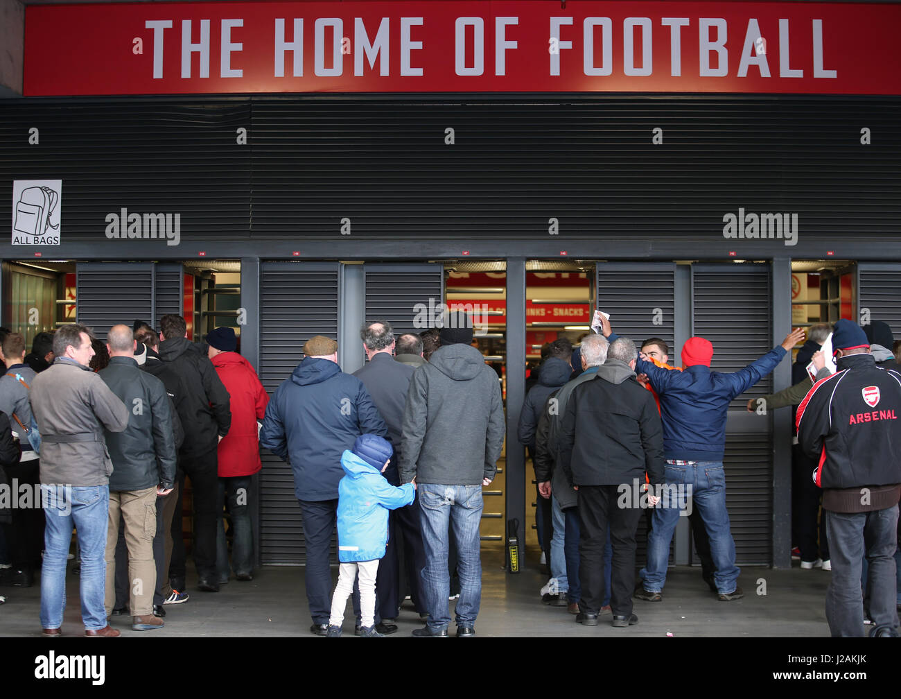 Fans queue outside during the Premier League match at the Emirates ...