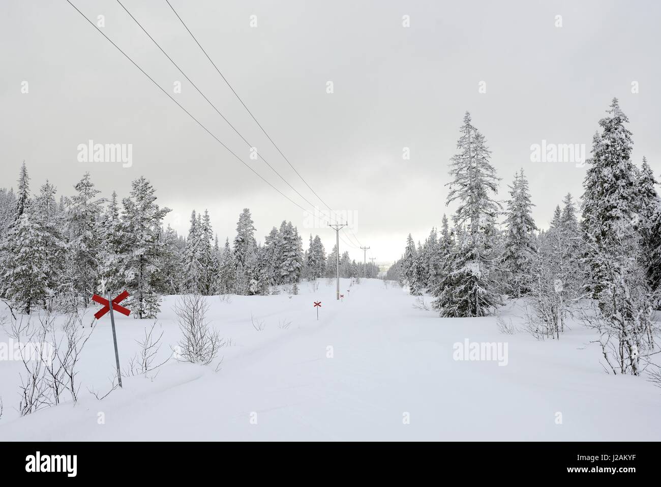 Route marker through arctic winter landscape Stock Photo - Alamy