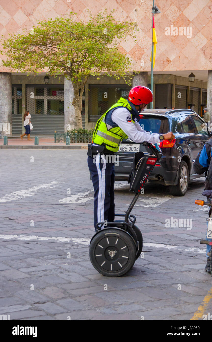 Cuenca, Ecuador - April 22, 2015: Policeman wearing red helmet on ...