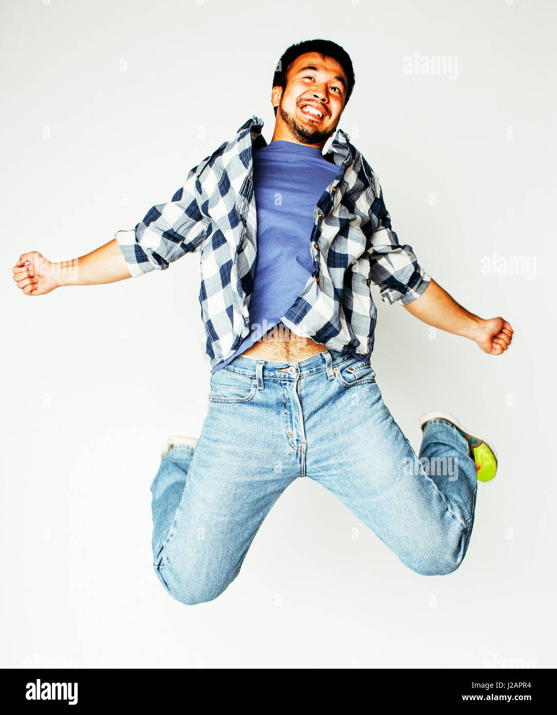young pretty asian man jumping cheerful against white background ...