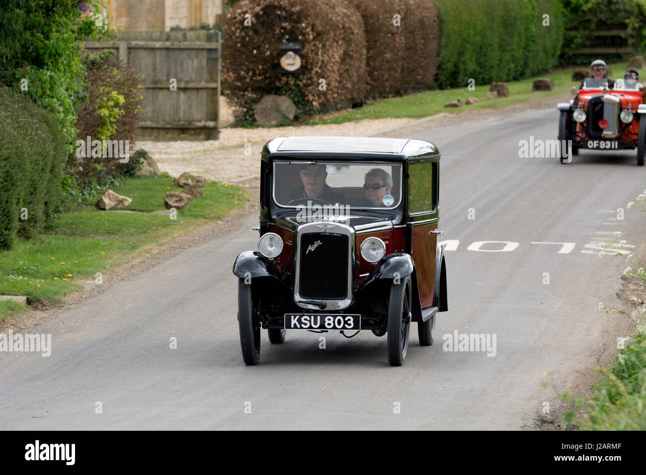 Austin Seven cars on a country road, Gloucestershire, UK Stock Photo ...